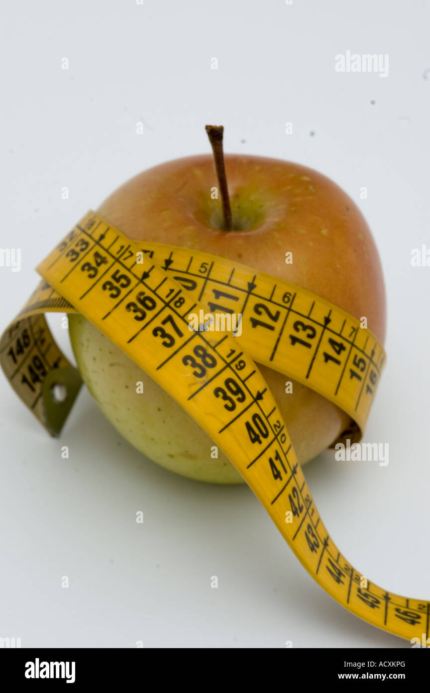 an apple with a strip measure Stock Photo - Alamy