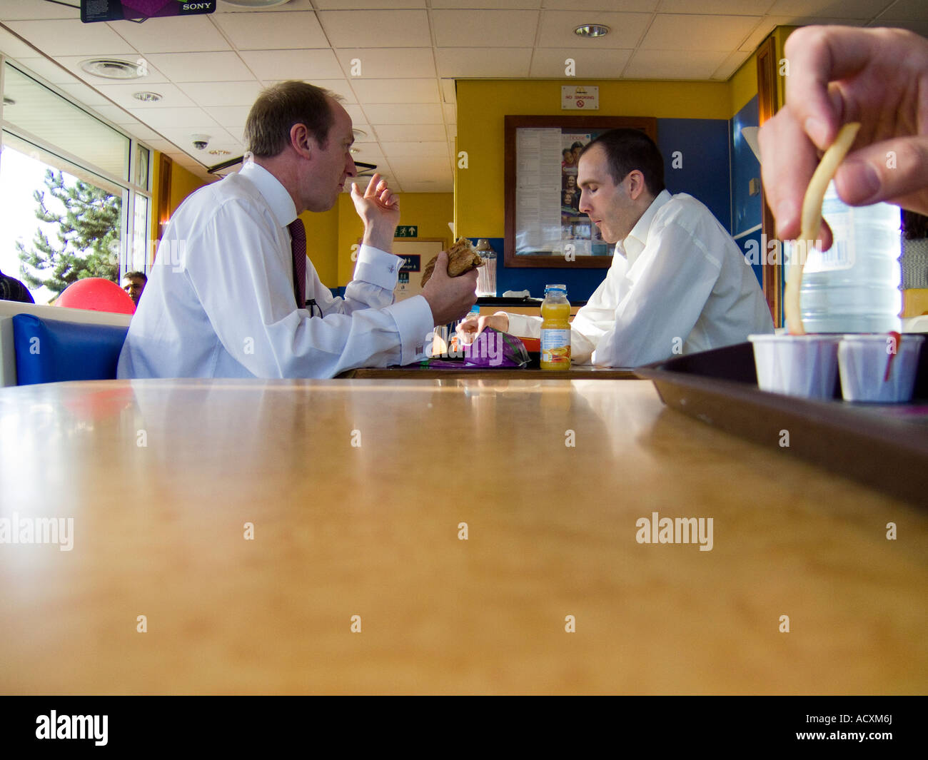 People eating in a fast food restaurant Stock Photo - Alamy