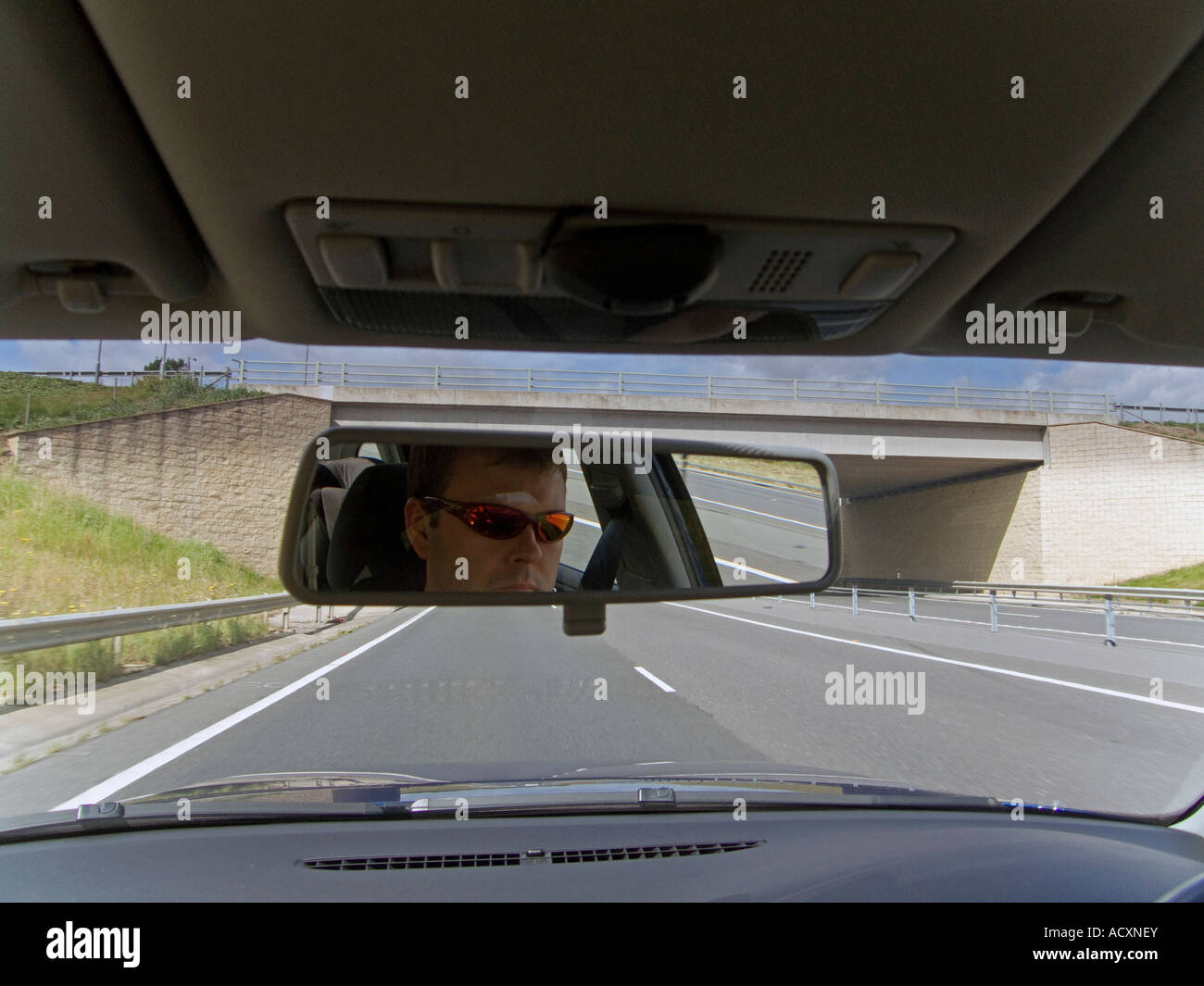 View out of the windscreen of a speeding car Stock Photo - Alamy