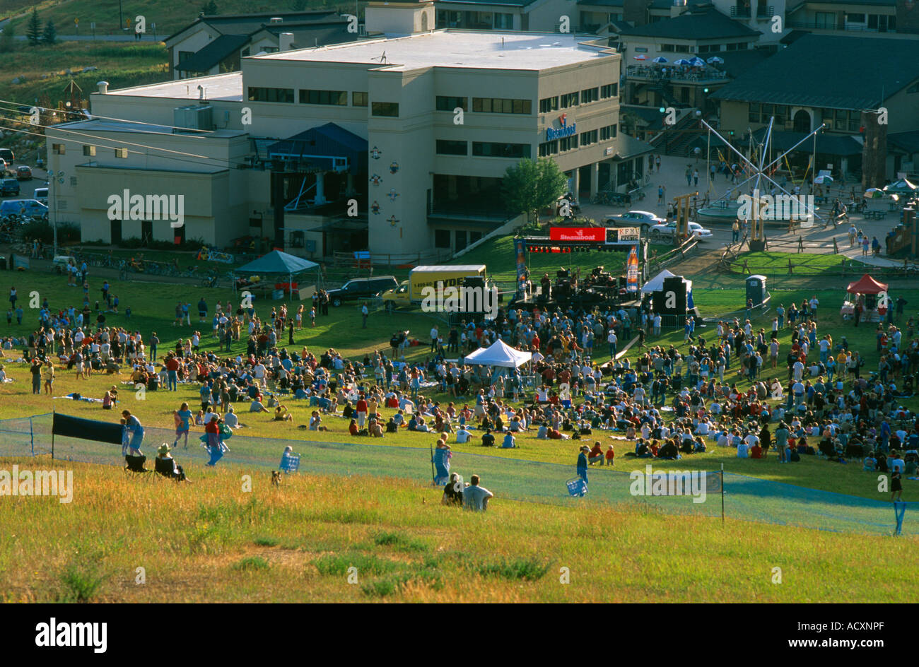Crowd watching The Radiators play a concert on headwall ski run ...