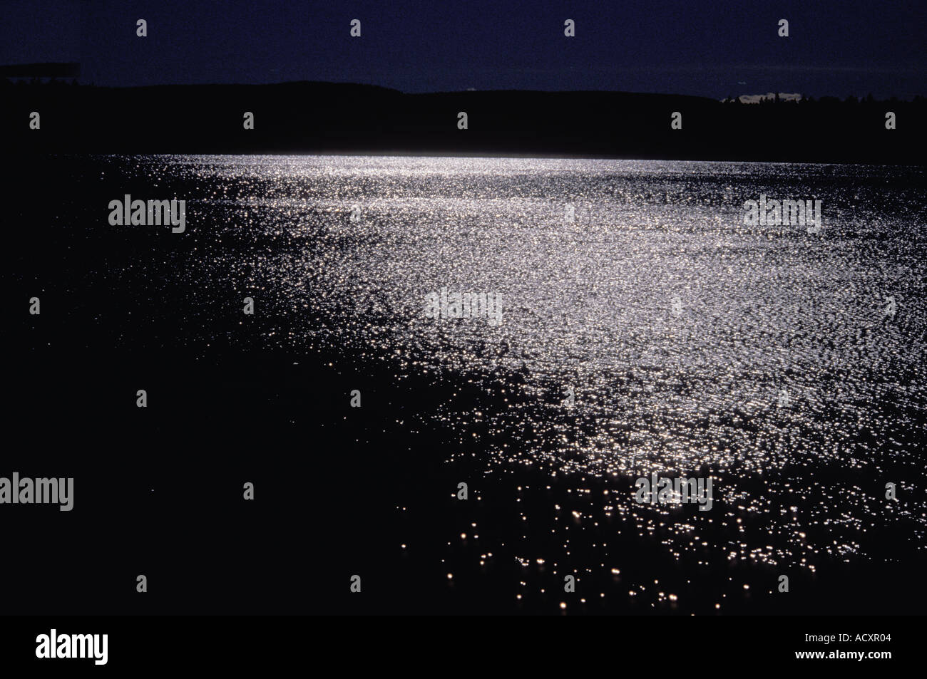 Sunlight sparkling on water Stock Photo - Alamy