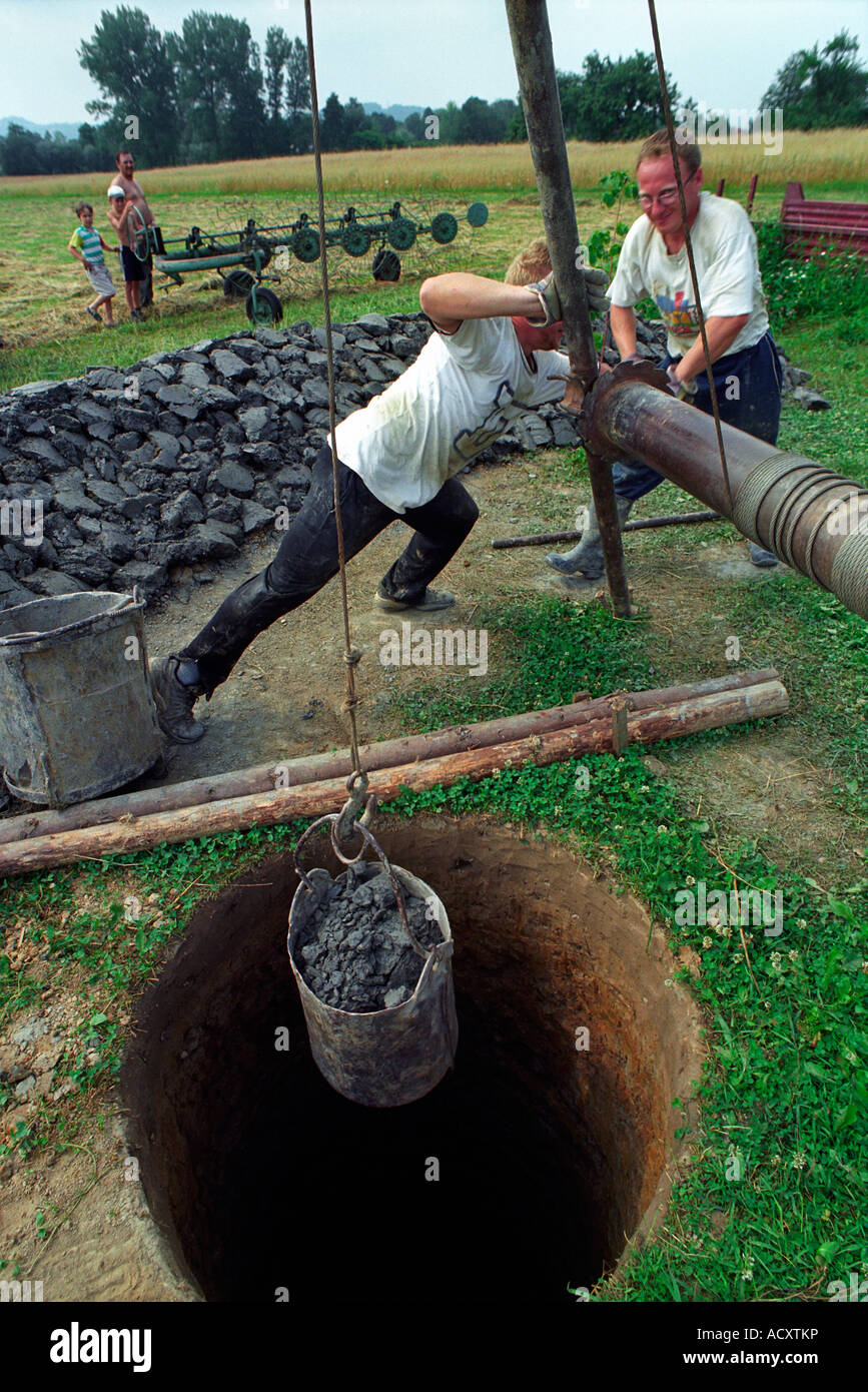 Men digging a well, Poland Stock Photo - Alamy