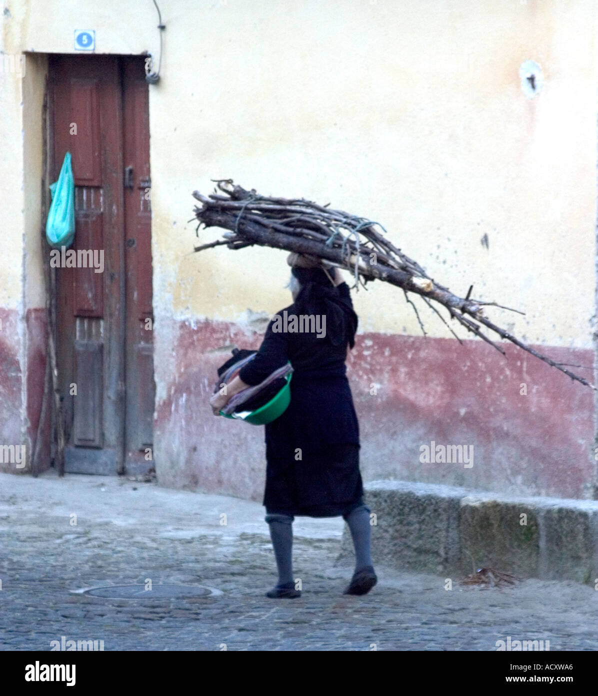 Woman Carrying Sticks On Head High Resolution Stock Photography and ...