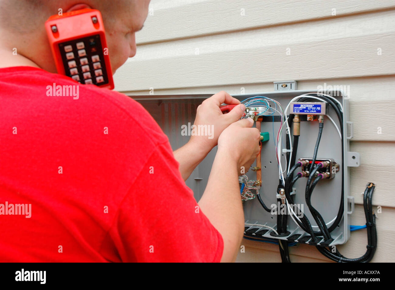 Installing cable TV and DSL lines and Phone lines on new house Stock ...