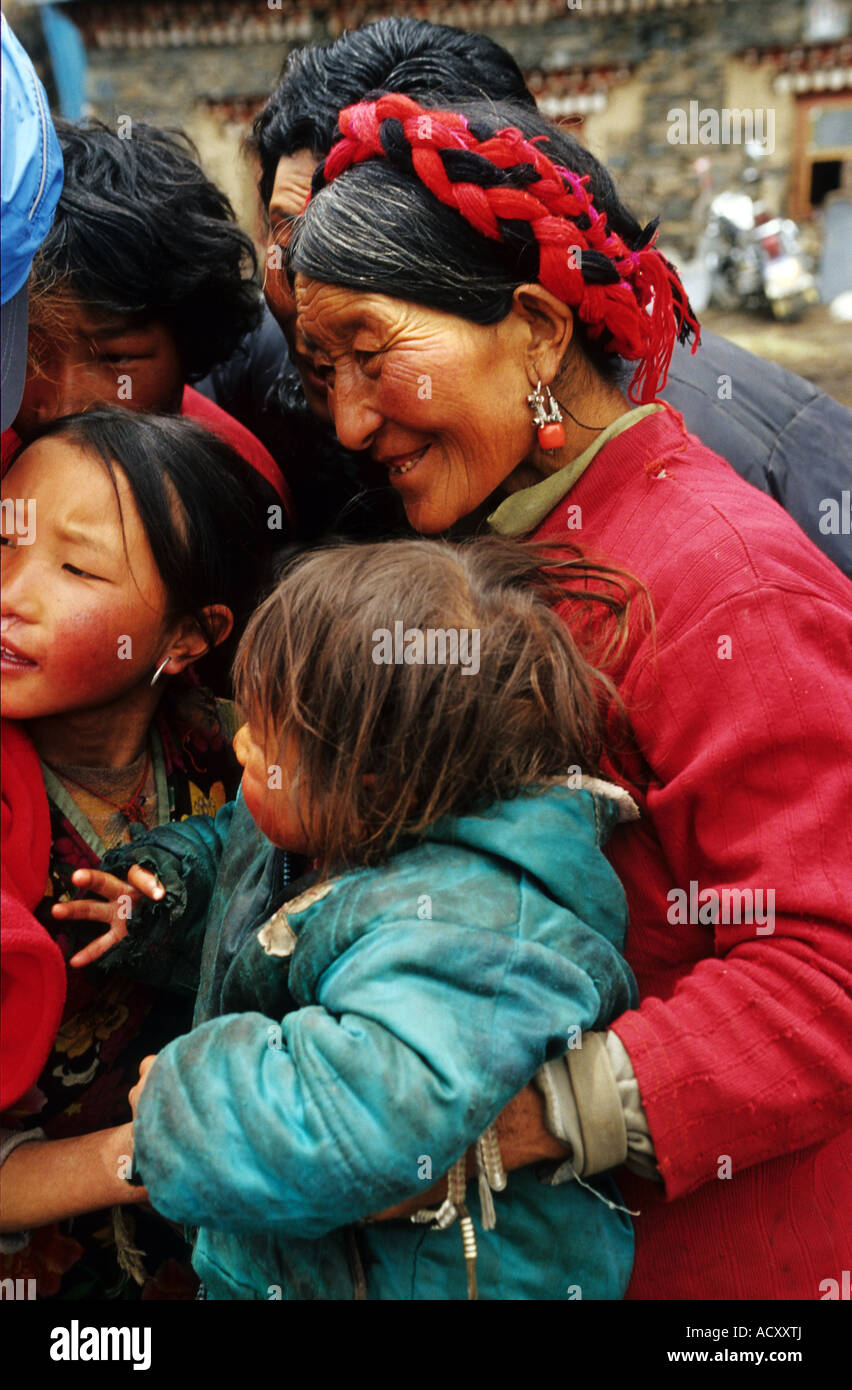 A Tibetan family look at their photos taken in a digital camera Stock ...
