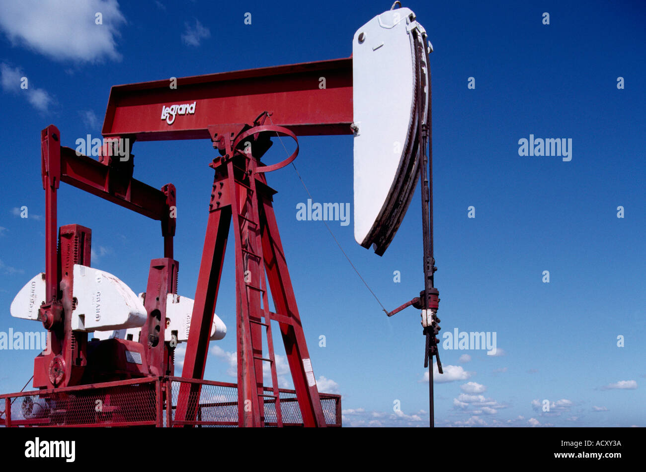 Pump Jack (Oil Donkey) pumping at Oil Well in Oil Field near Fort St ...