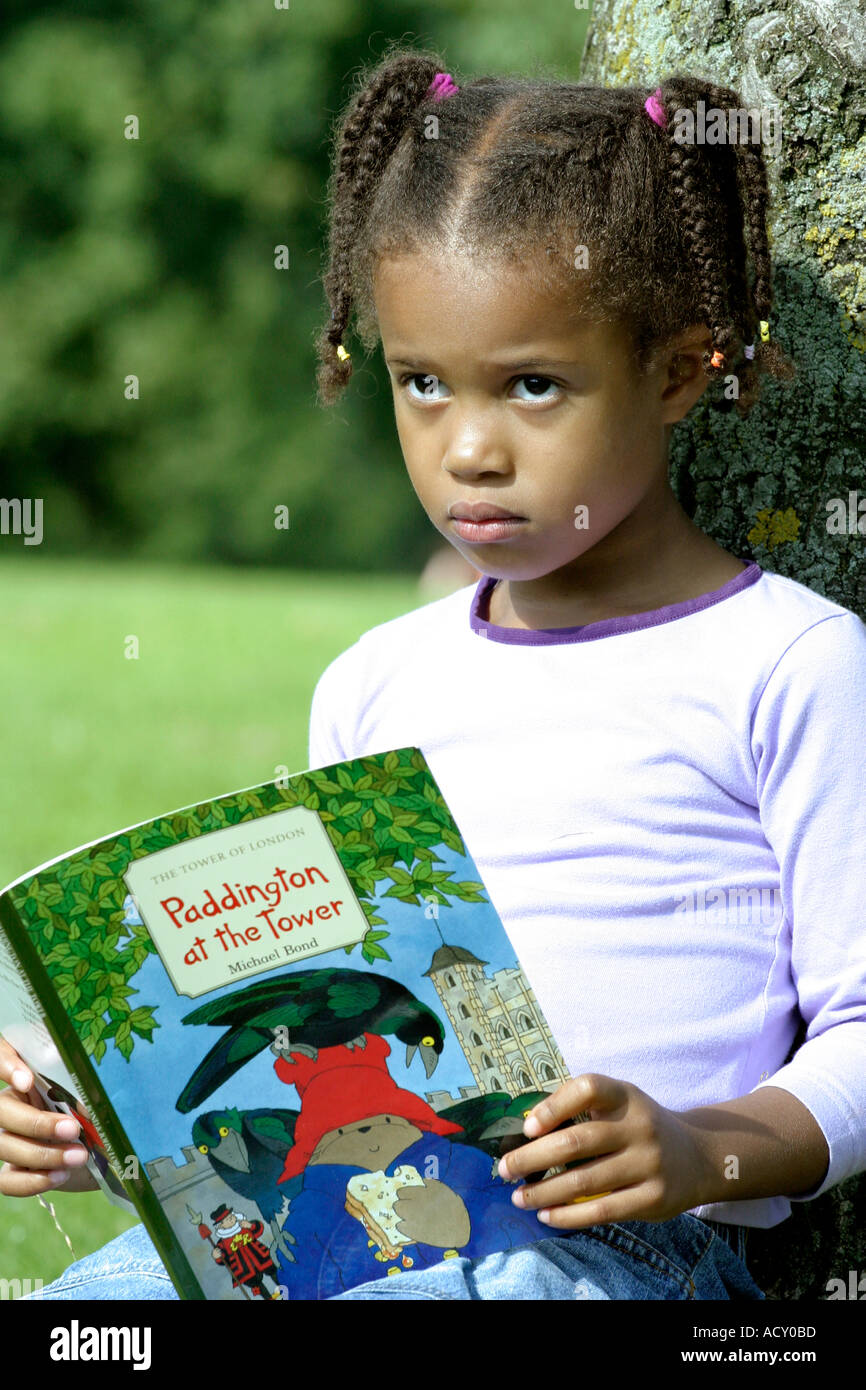 Girl reading book Stock Photo - Alamy