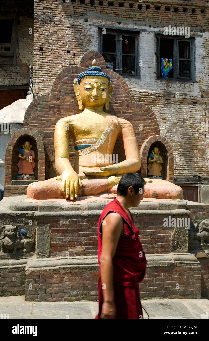 Yellow Buddha and tibetan monk.Swayambhunath Stupa.Kathmandu.Nepal ...