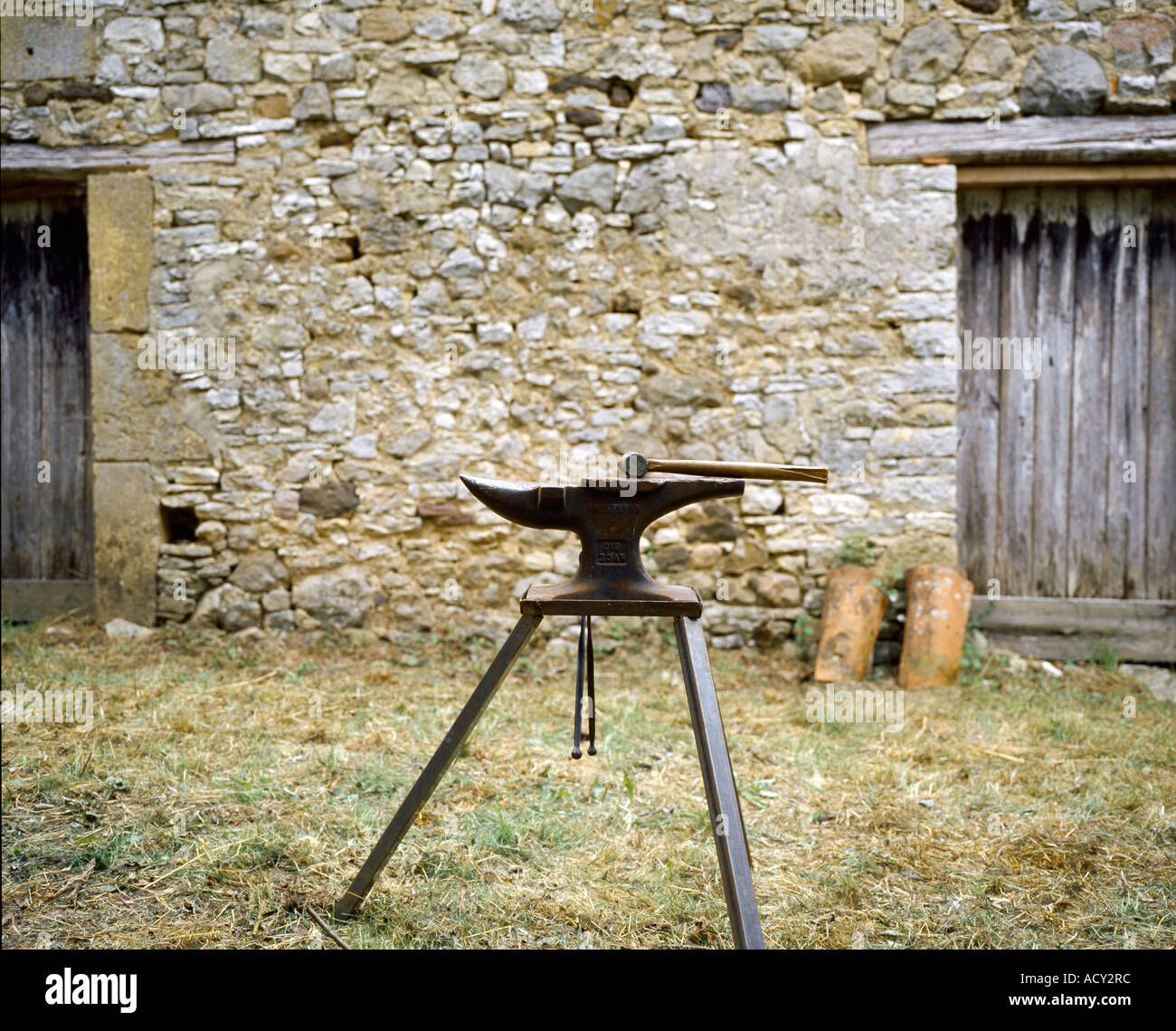 An traditional blacksmith's Anvil outside a barn in South West France ...