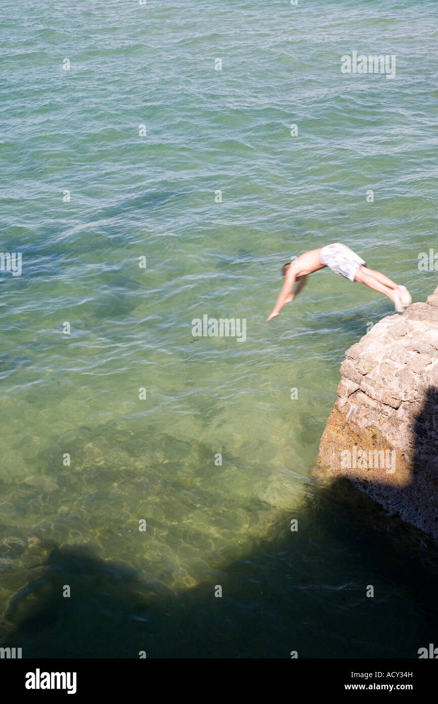 Boy jumping into the water, Cadiz, Spain Stock Photo - Alamy