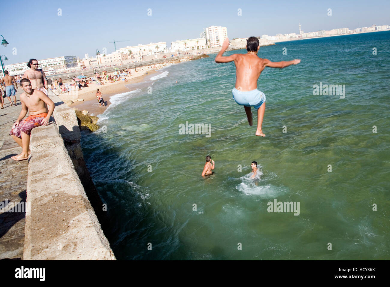 Boy jumping into the water, Cadiz, Spain Stock Photo - Alamy