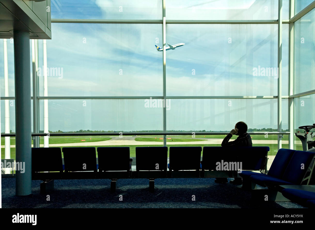 Man waiting at the boarding gate. Stansted airport. UK Stock Photo - Alamy