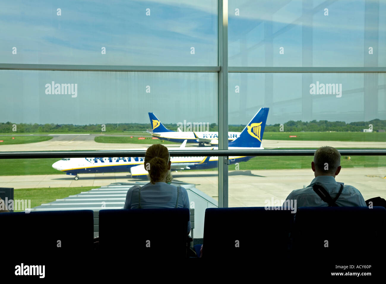 People waiting at the boarding gate. Stansted airport. UK Stock Photo ...