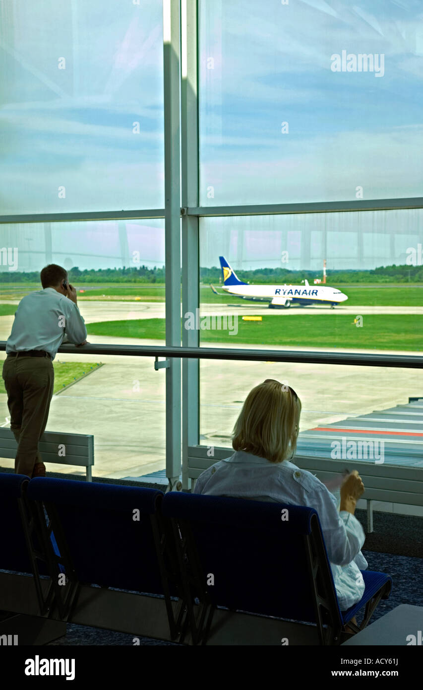 People waiting at the boarding gate. Stansted airport. UK Stock Photo ...
