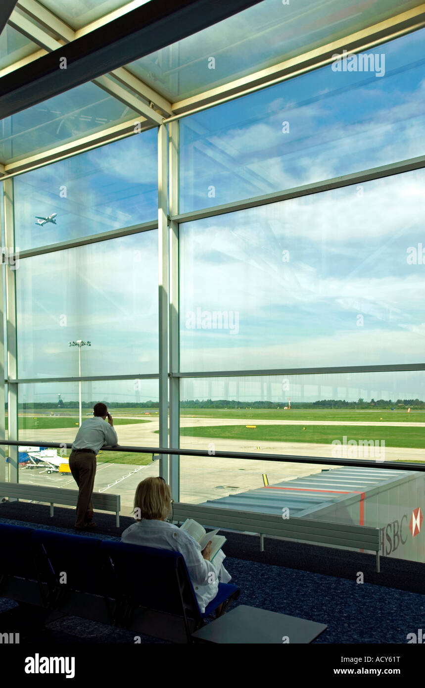 People waiting at the boarding gate. Stansted airport. UK Stock Photo ...