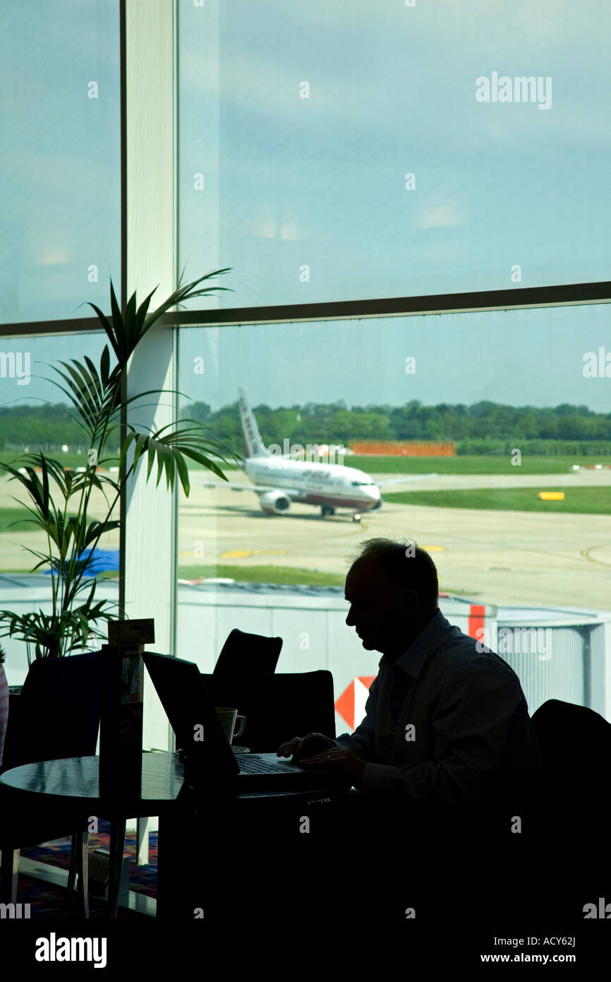 Man waiting at the boarding gate. Stansted airport. UK Stock Photo - Alamy