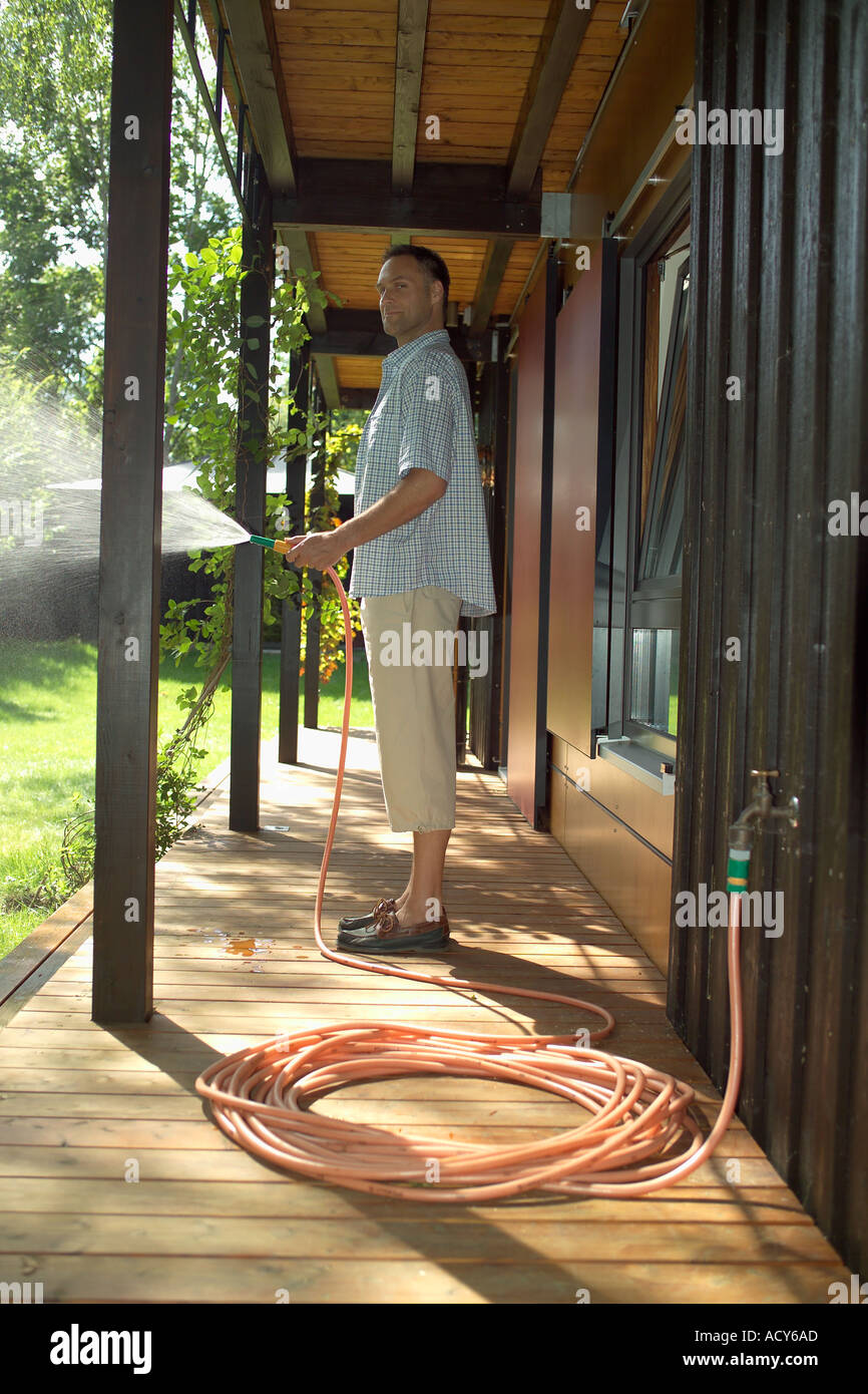 Person using hosepipe hi-res stock photography and images - Alamy