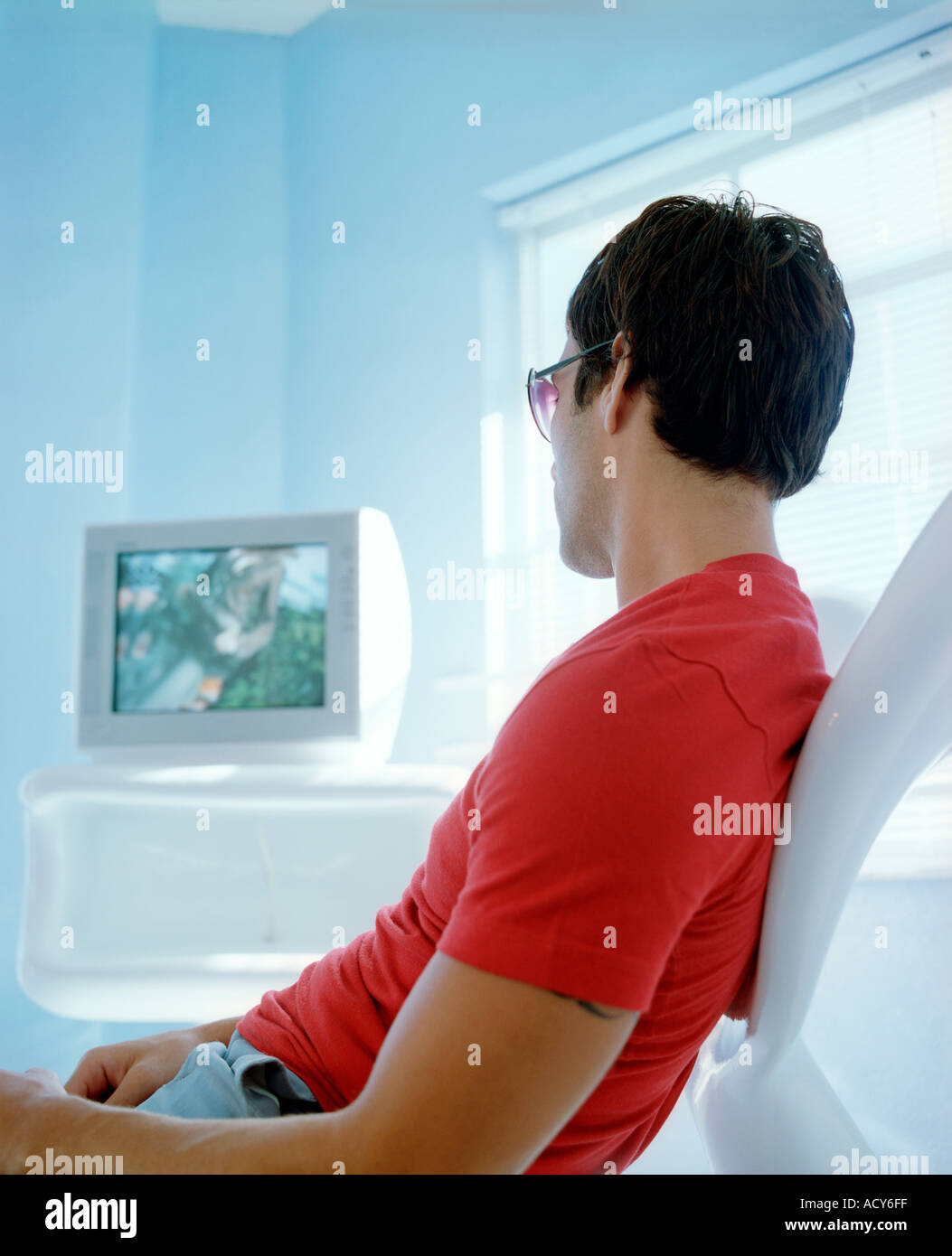 Man watching tv alone in dark hi-res stock photography and images - Alamy