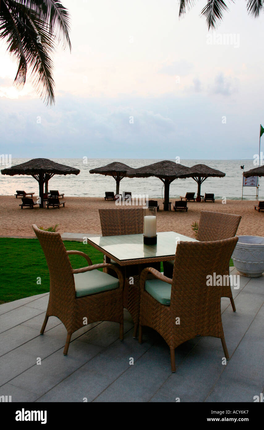 Table and chairs at beach resort Stock Photo - Alamy