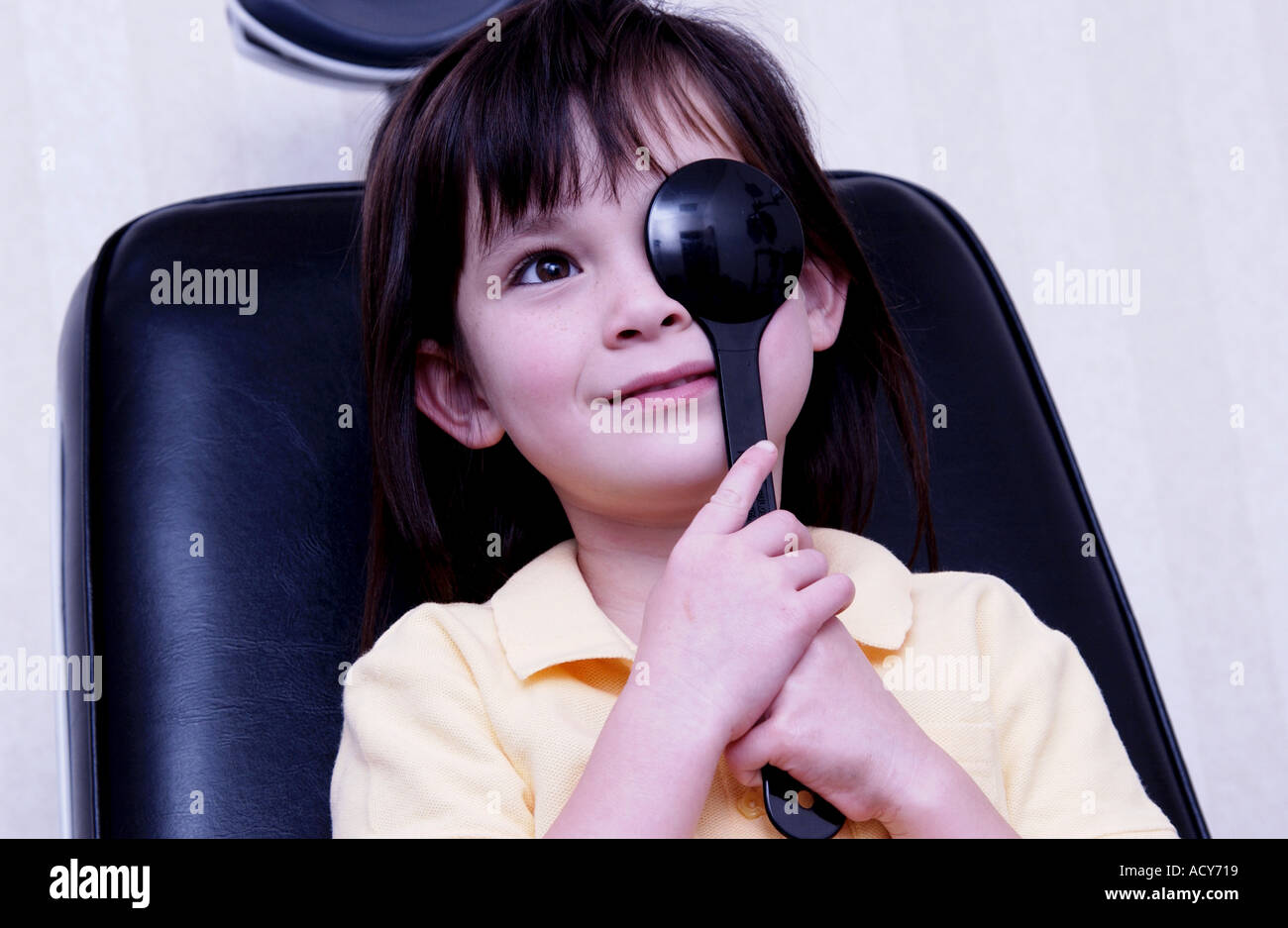 Girl getting vision tested Stock Photo - Alamy