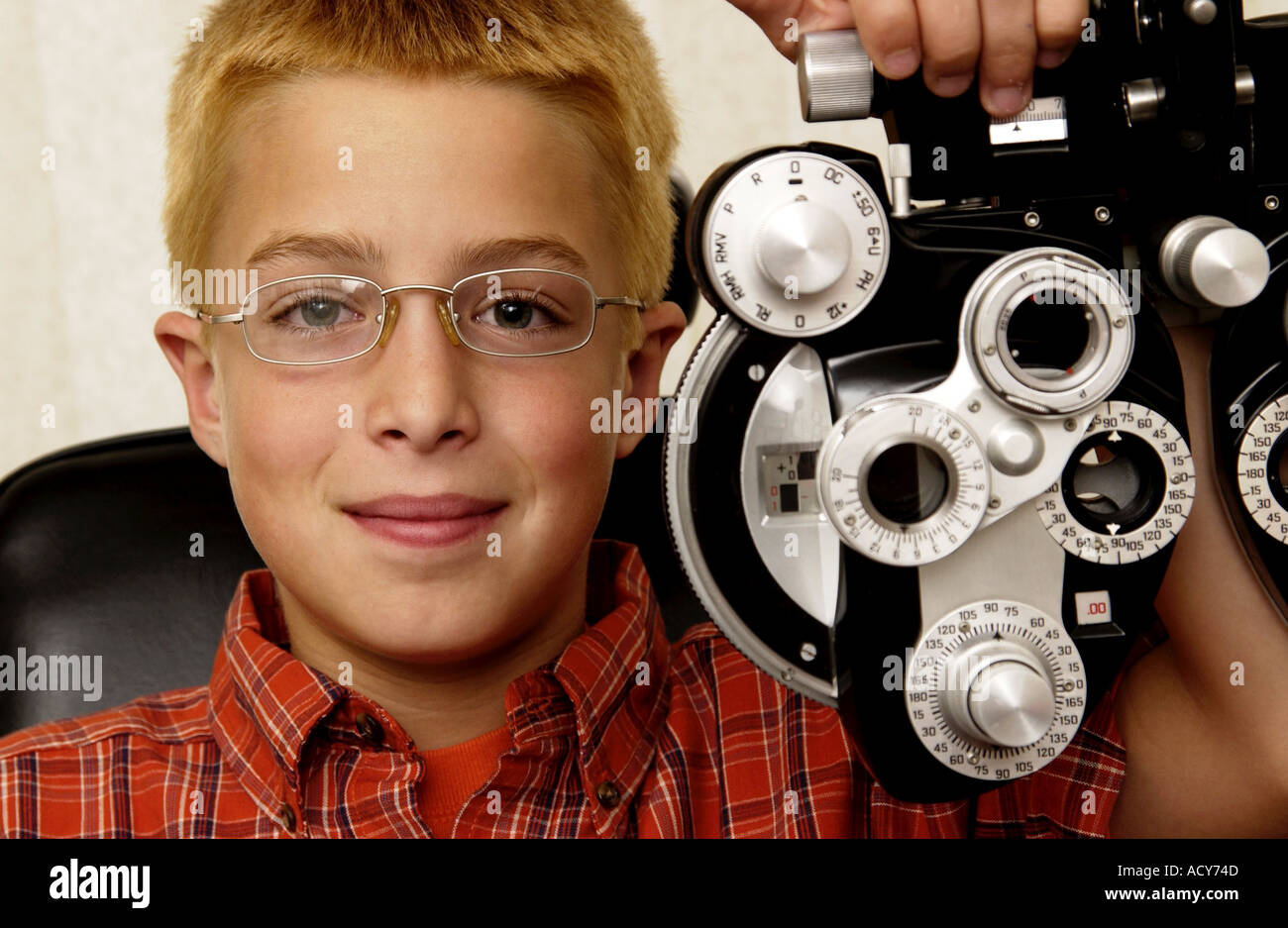 Boy getting eye exam Stock Photo - Alamy