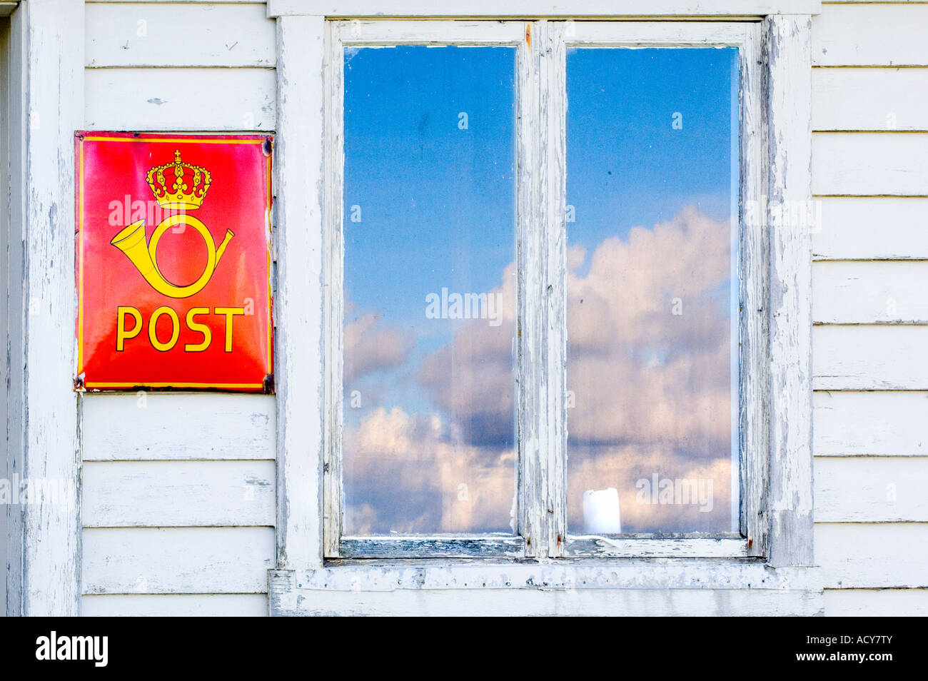 post office sign and sky reflected in the window Stock Photo - Alamy