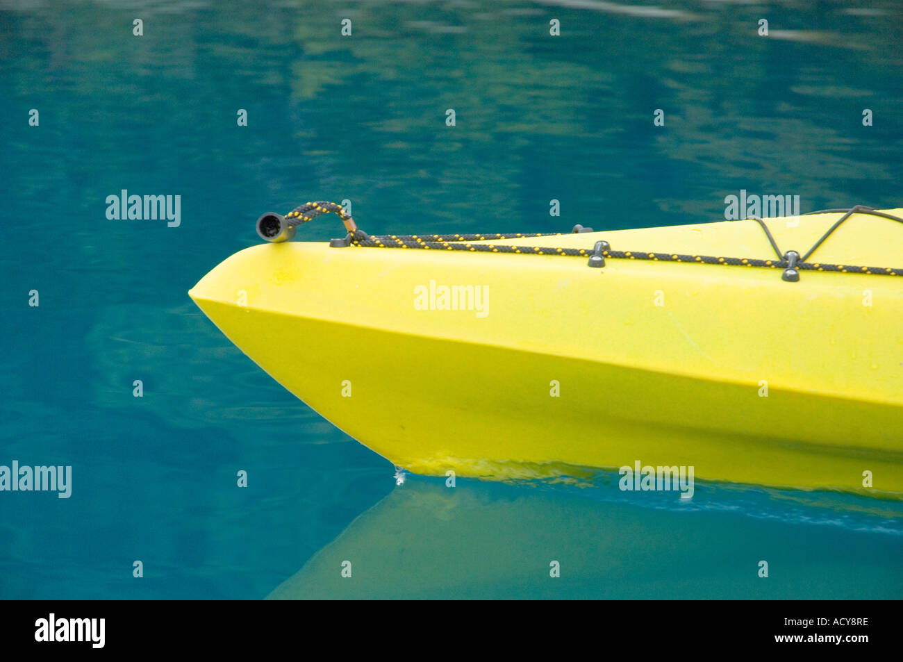 Front of yellow Kayak on calm water Stock Photo - Alamy