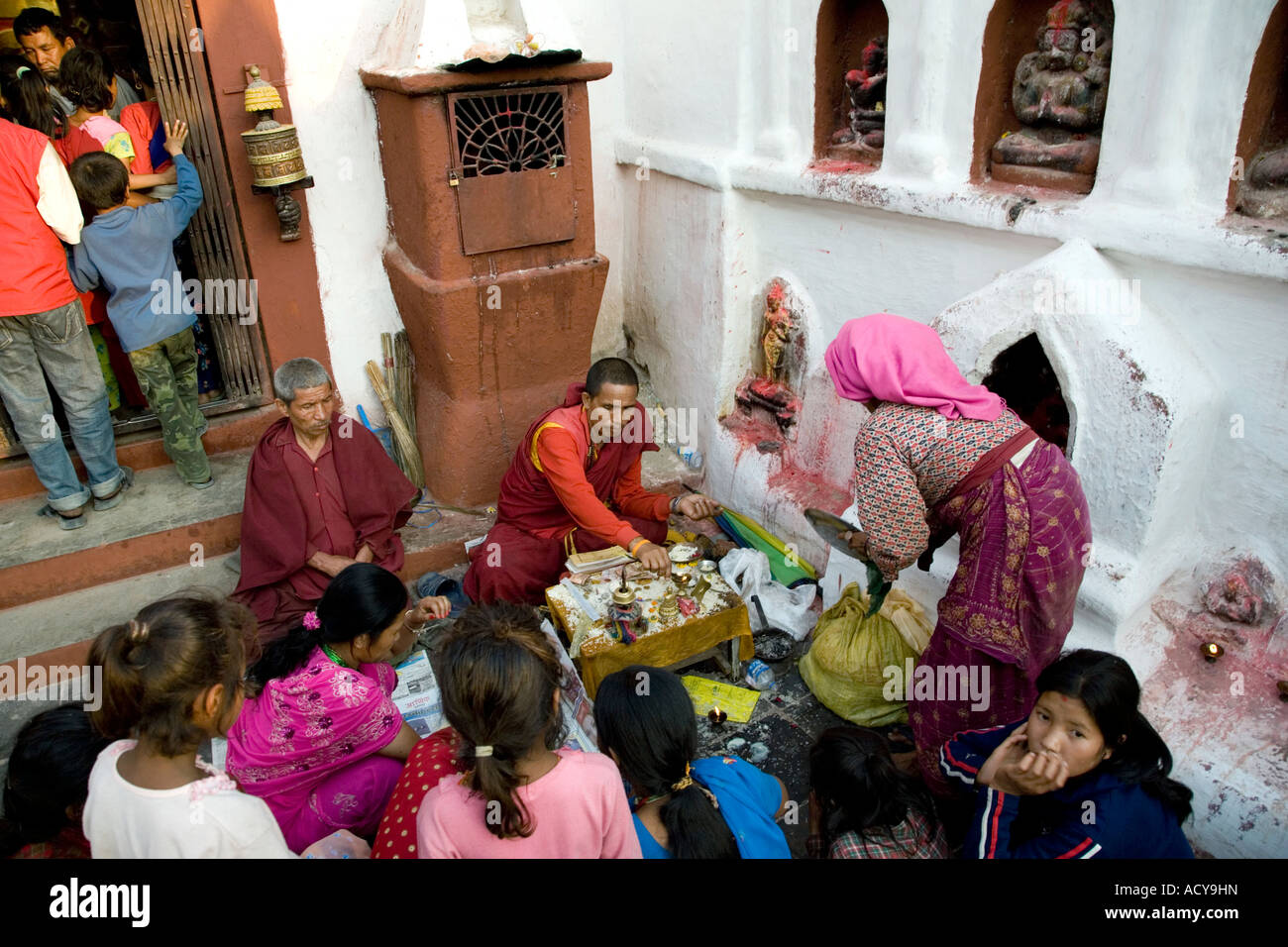 Family making a puja ceremony.Ajima Shrine.Bodhnath Stupa.Kathmandu ...