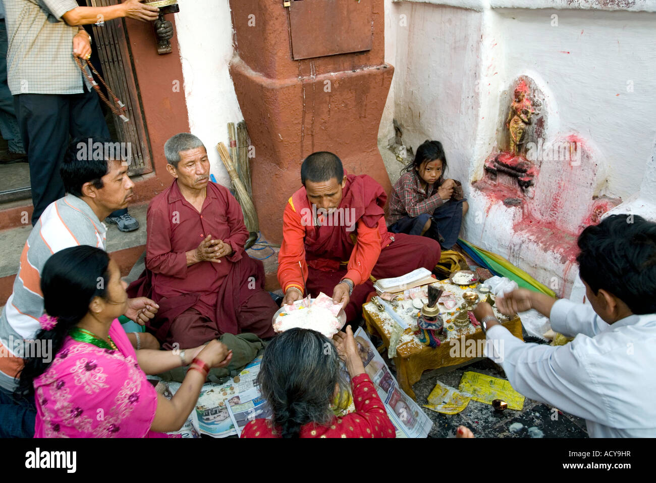 Family making a puja ceremony.Ajima Shrine.Bodhnath Stupa.Kathmandu ...