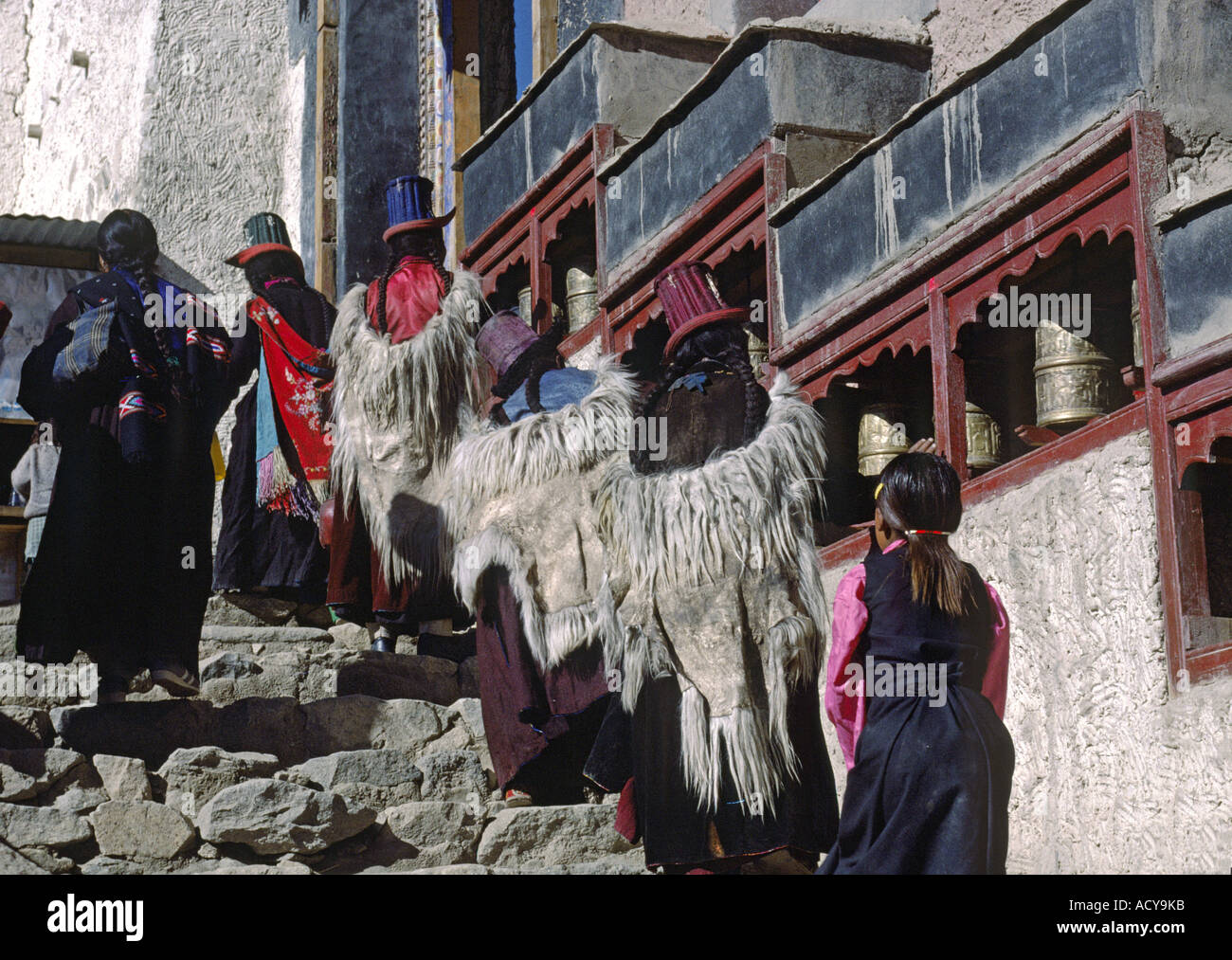 PILGRIMS in sheepskin chubas and PRAYER WHEELS on the steps to TIKSE ...