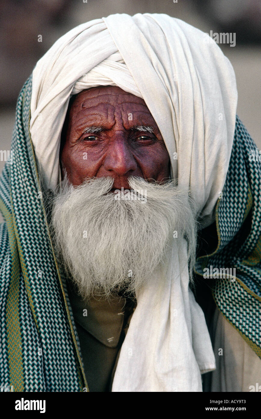 RAJASTHANI CAMEL TRADER wearing a traditional WHITE TURBAN head wrap at ...
