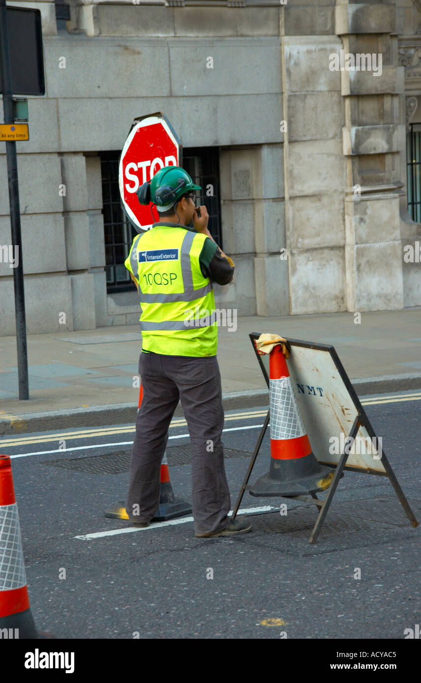 Workman holding stop sign High Resolution Stock Photography and Images ...