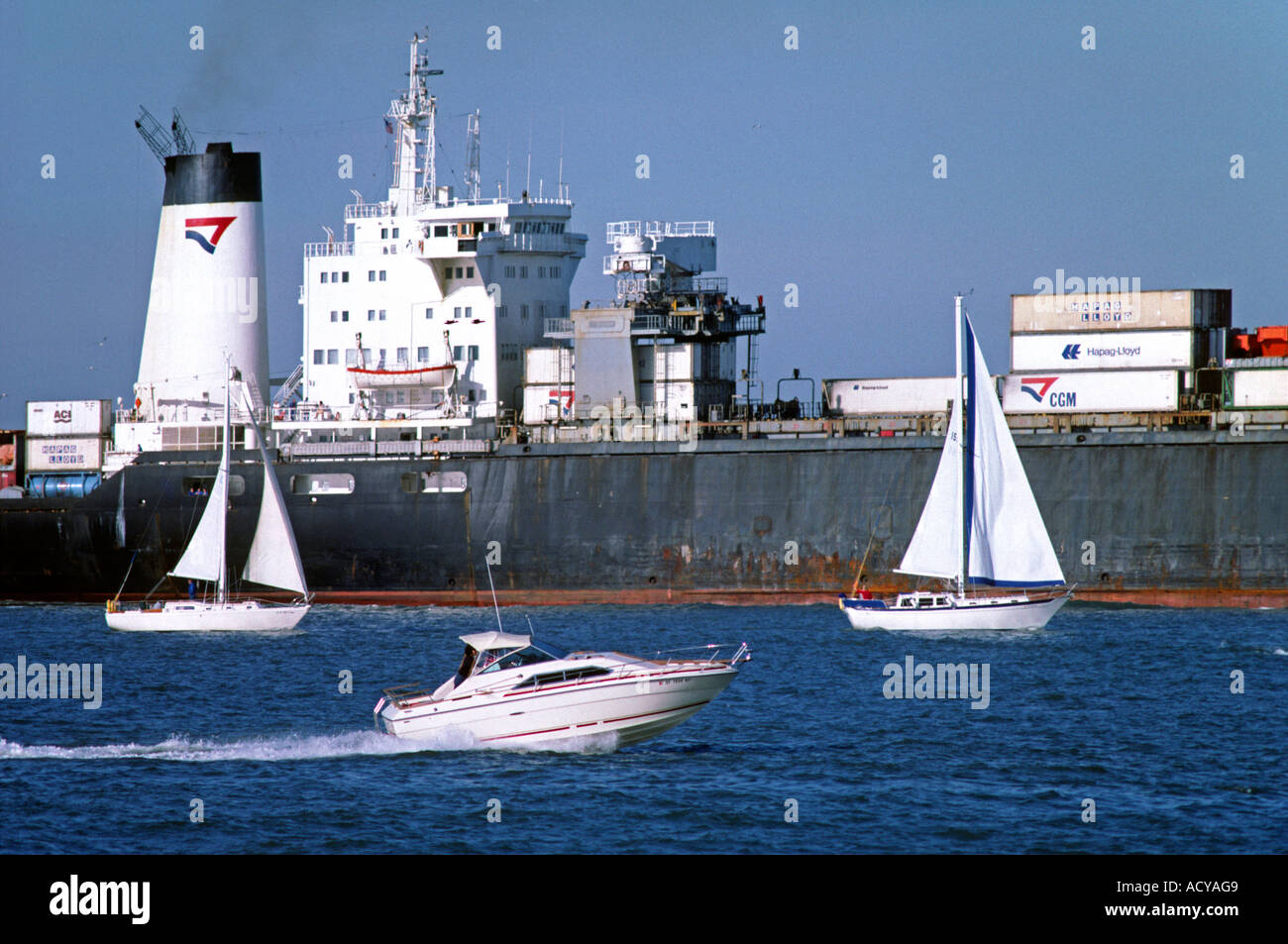 Two SAIL BOATS SPORT BOAT cruising in front of big TANKER in SAN ...
