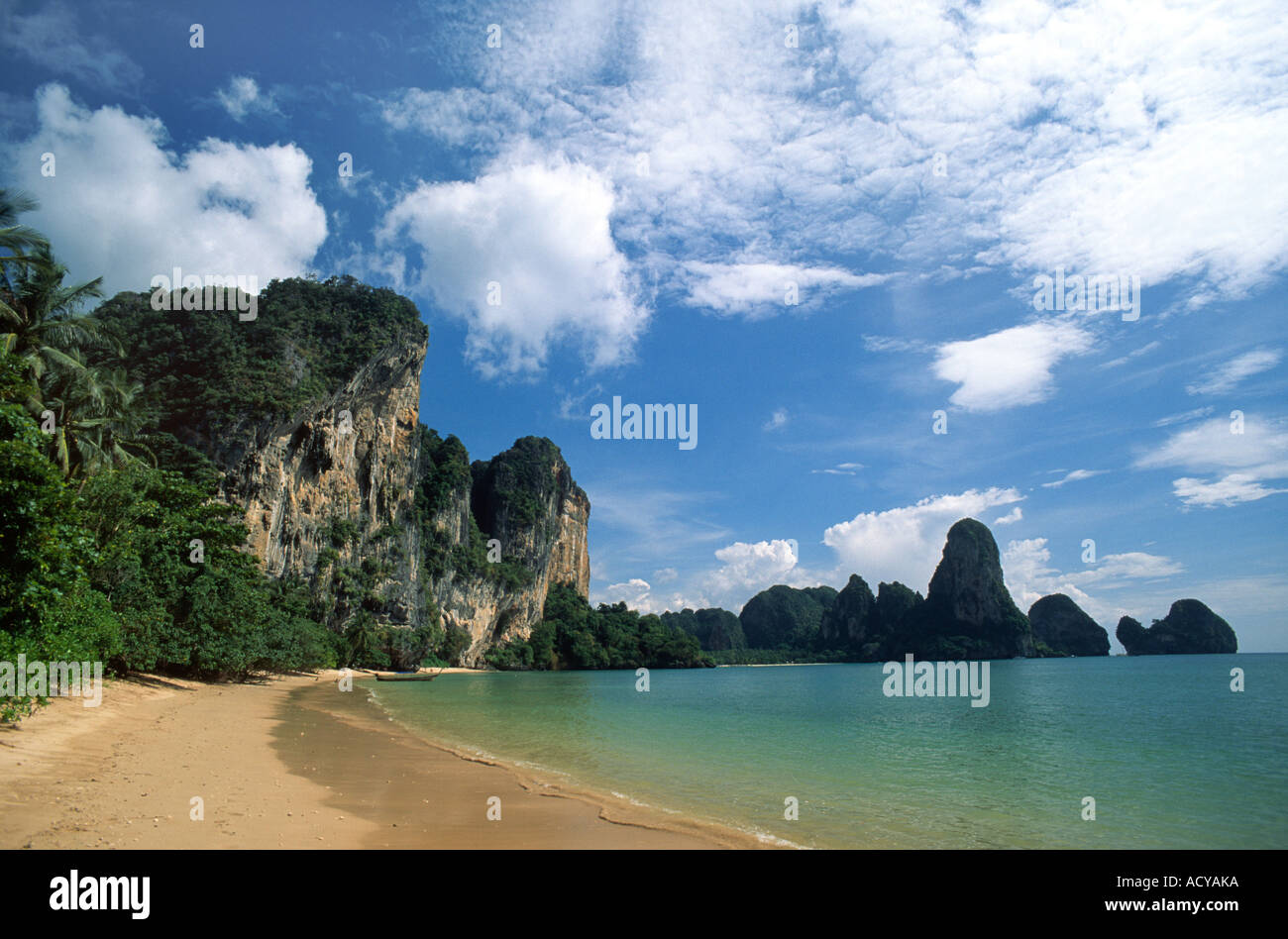 LIMESTONE CLIFFS drop into the clear tropical waters of KRABI BEACH ...