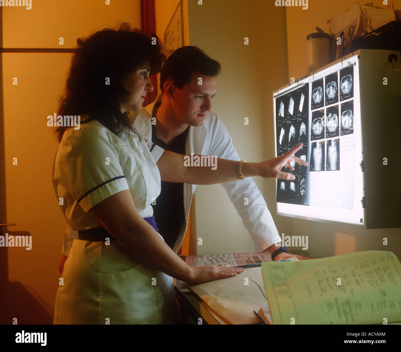 Doctor and Nurse looking at X Ray Hospital Stock Photo - Alamy