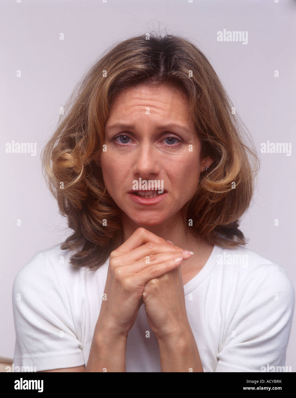 Woman looking worried Stock Photo - Alamy