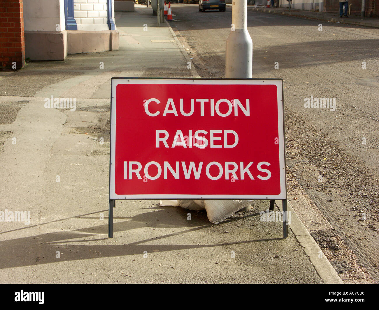 Caution Raised Ironworks sign on the side of a main road where ...