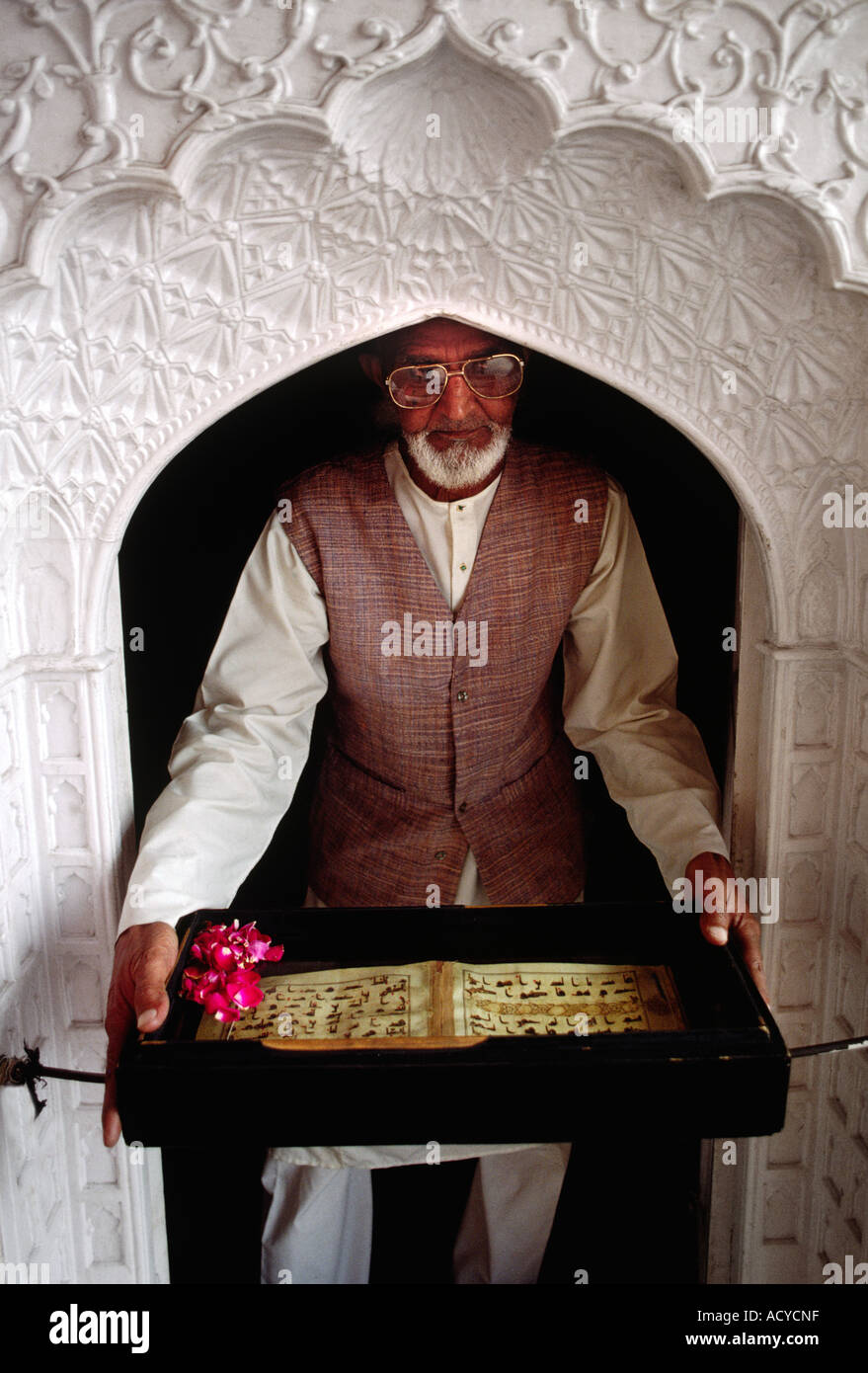 A Muslim CLERIC displays MOHAMMED S SCRIPTURES at the JAMA MASJID ...