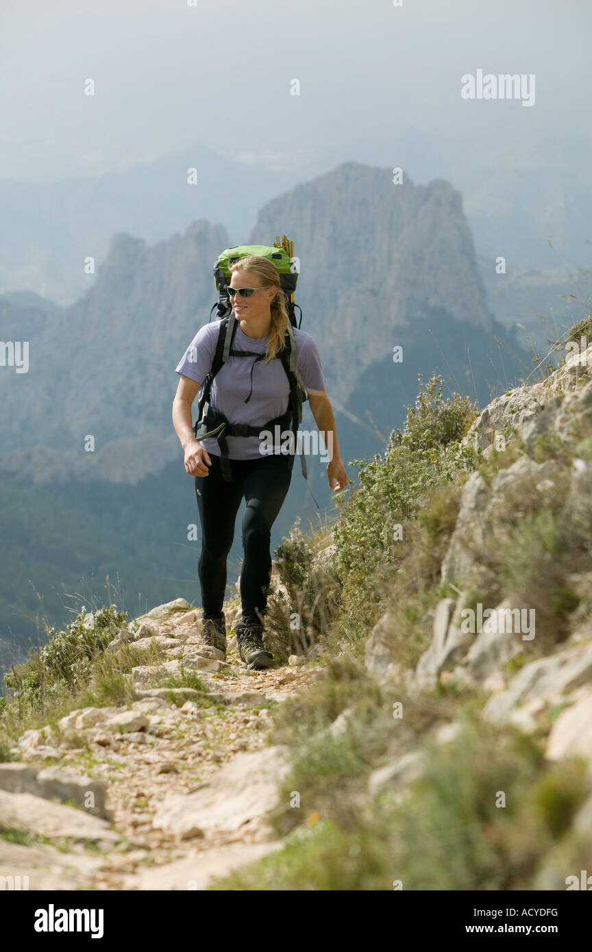 Female hiker on mountain path Stock Photo - Alamy