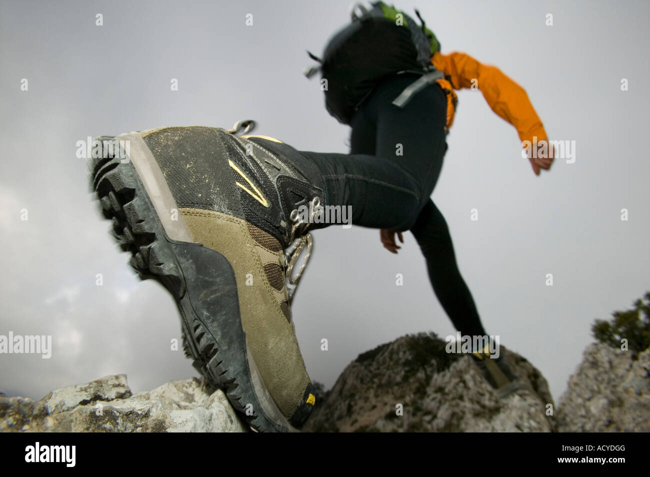 Hiker shot from low angle illustrating boot Stock Photo - Alamy
