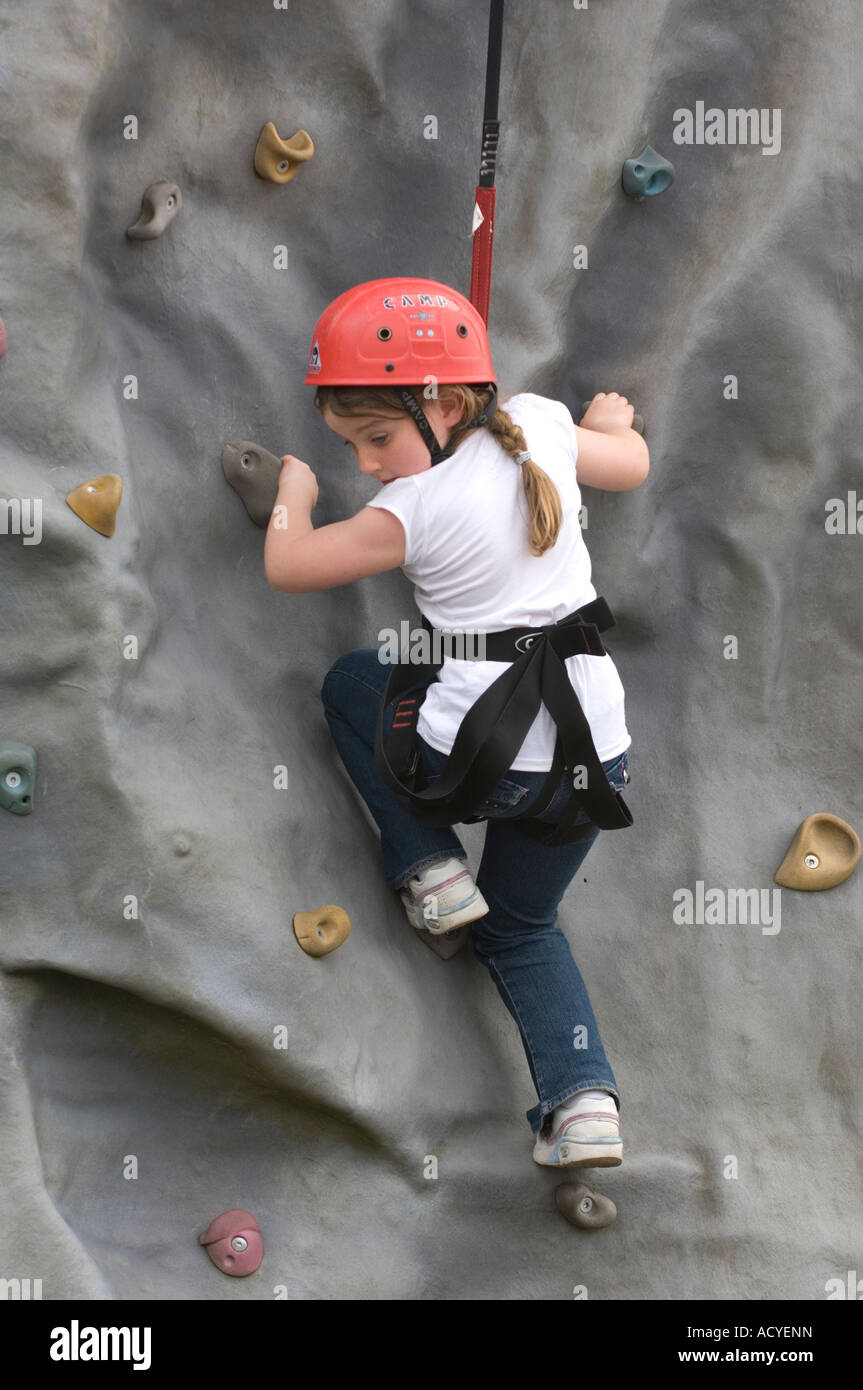 Young child rock climbing Stock Photo - Alamy