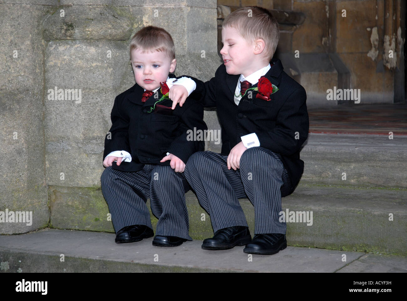 Two brothers talking at a wedding Stock Photo - Alamy
