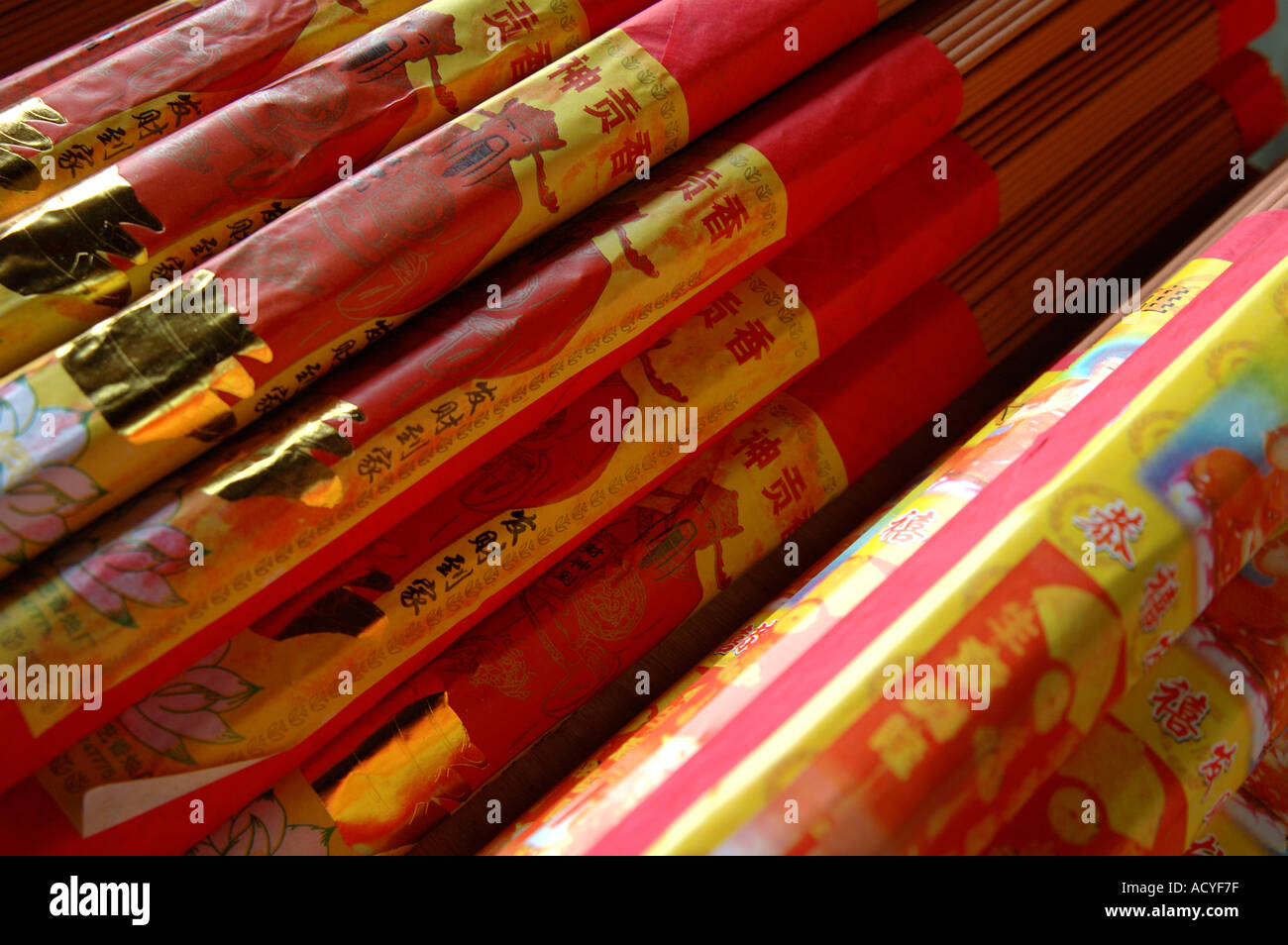 Packs of Chinese incense sticks wrapped in red and gold paper. For sale ...