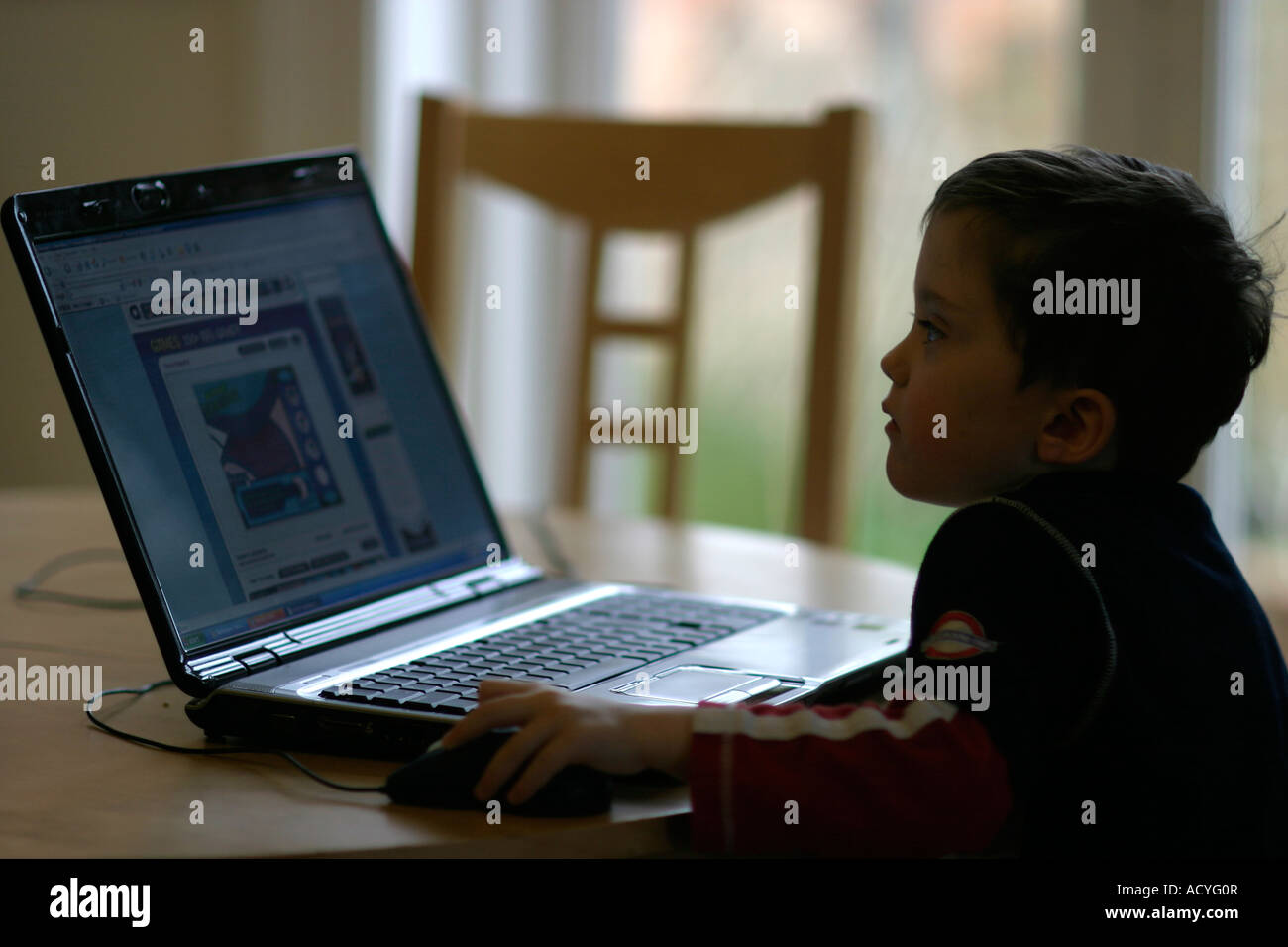 small boy using a portable computer Stock Photo - Alamy
