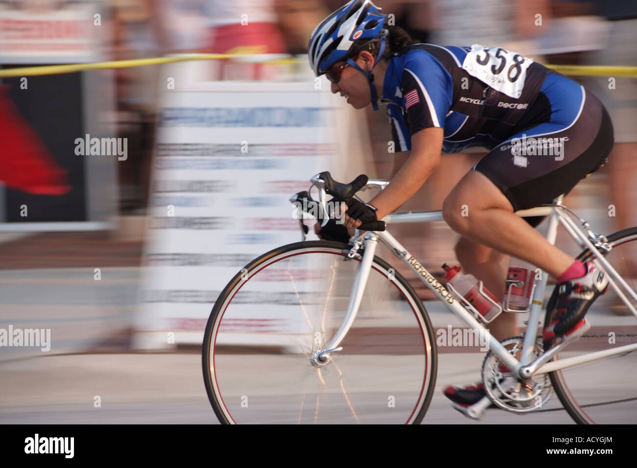 A young lady riding her bicycle on high speed Stock Photo - Alamy