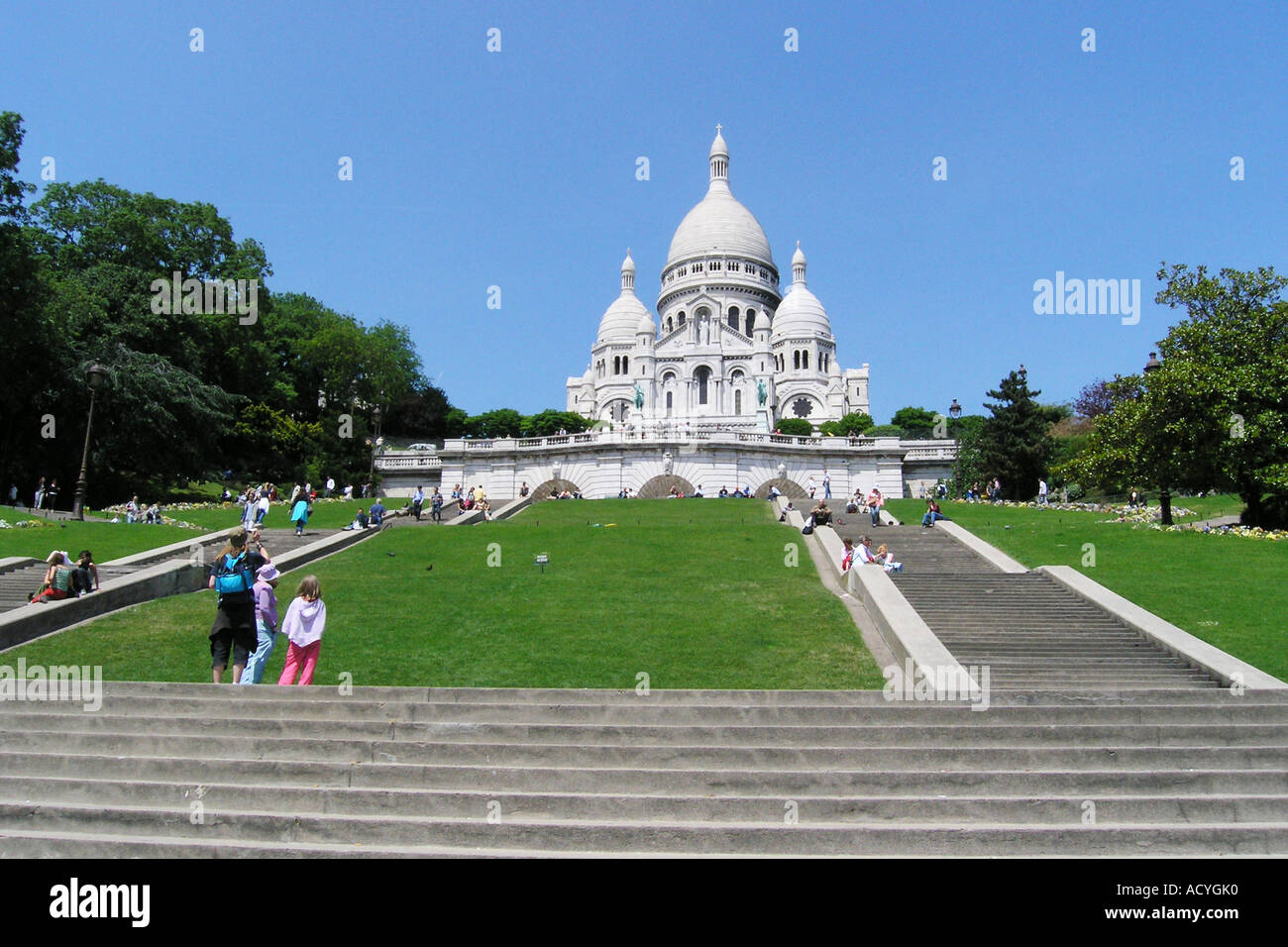 Long distance view of Sacre Coeur with steps and lawns Paris France ...