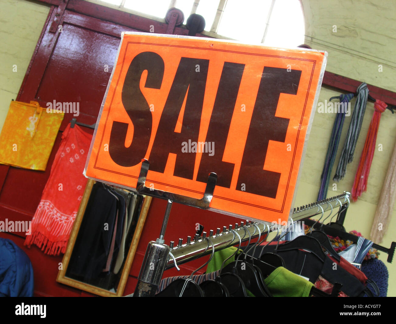 Shop with orange sale sign Stock Photo - Alamy
