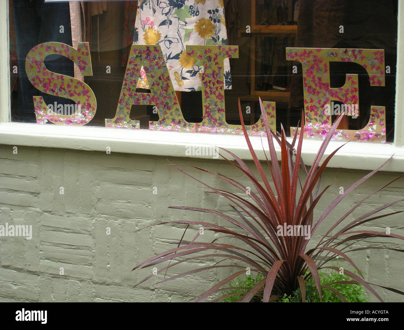 Shop window with sale sign Stock Photo - Alamy