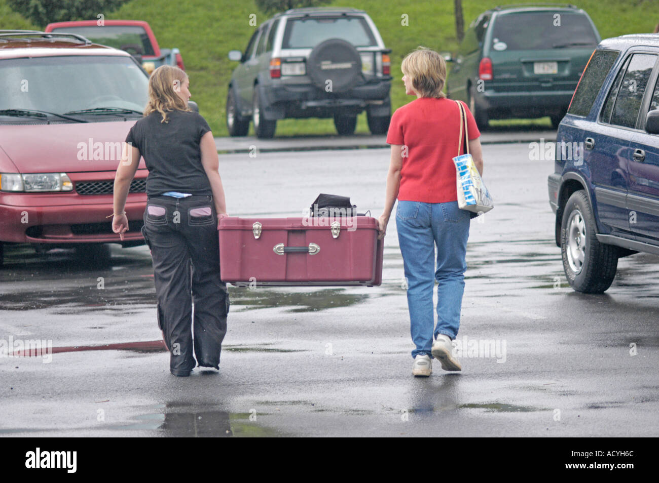 Loading kids items at camp parking lot for summer time vacation of ...