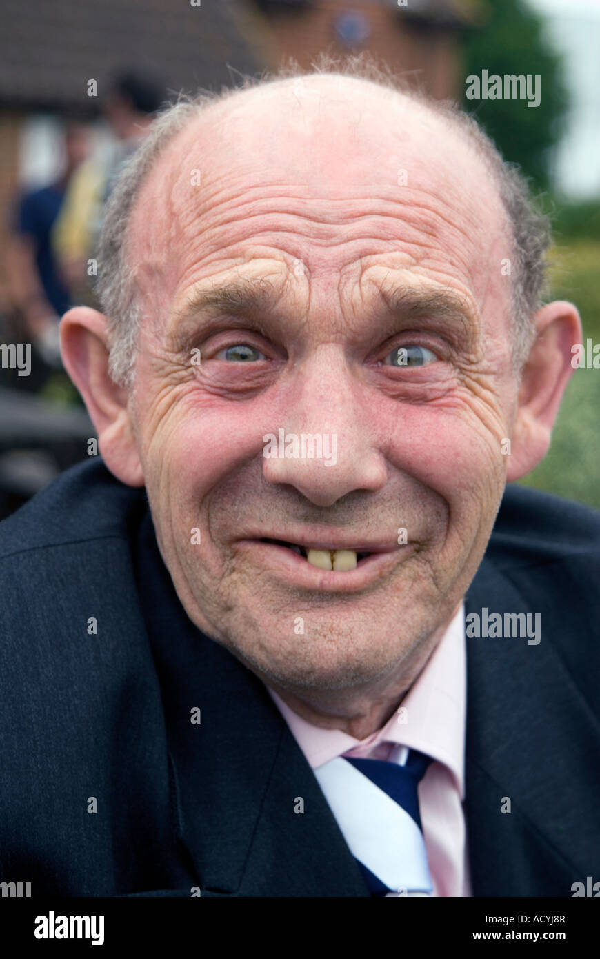 Interesting expression on the face of an old man Stock Photo - Alamy